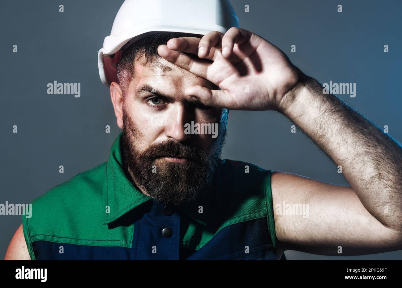 Bearded tired man wipes sweat hi-res stock photography and images - Alamy