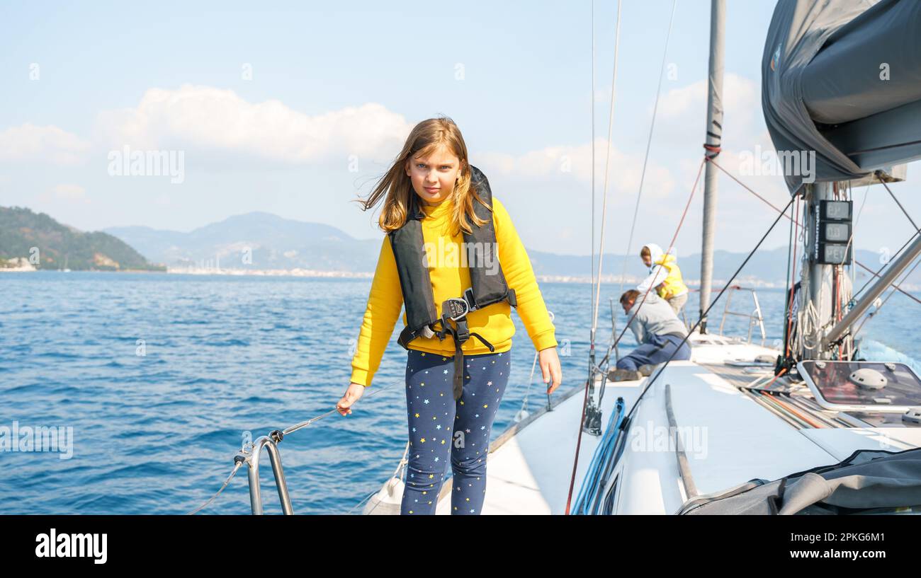 Voyage sail on sport sea luxury yacht. Yachting family summer vacation cruise. Children, sailor ...