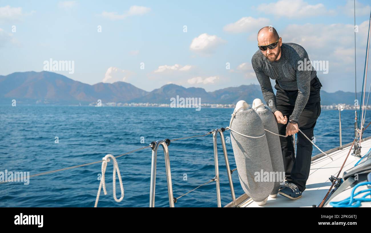 Voyage race sail on professional sport sea yacht. Mooring fender ...