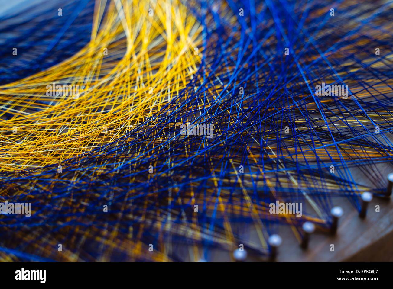 Colored thread mandala on a wooden board with nails. Mandala Moon ...