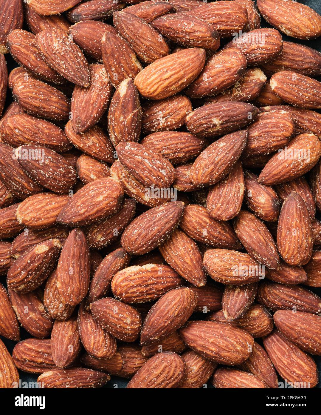 Roasted salted almonds closeup, background. Nuts texture Stock Photo ...