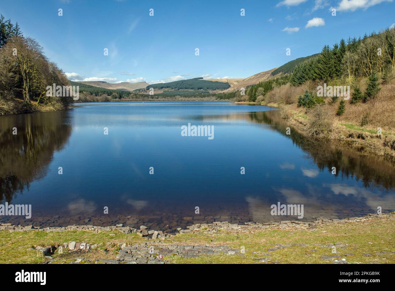View up to the Central Brecon Beaonc overlooking Pentwyn Reservoir on a ...