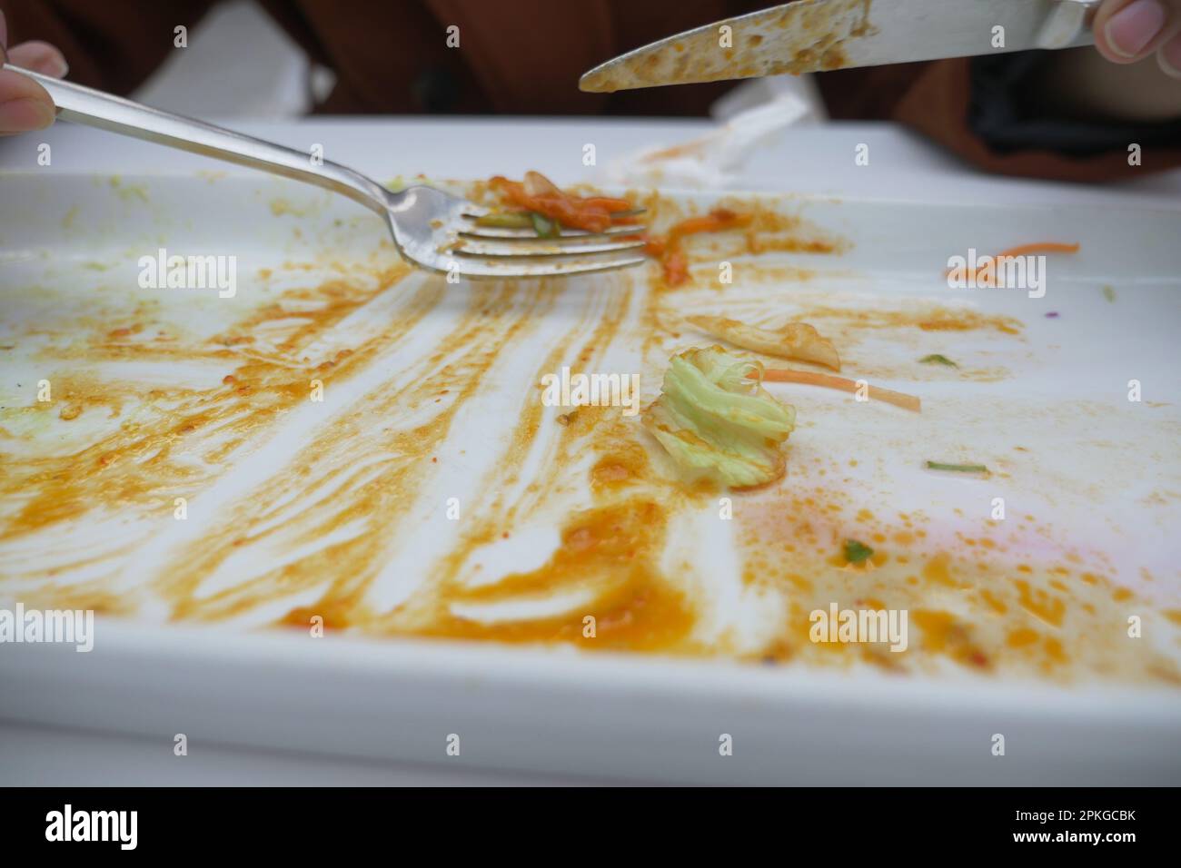 Empty plate after eating on table Stock Photo - Alamy