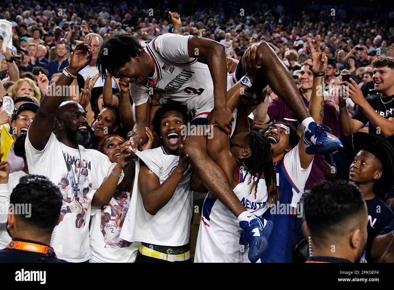 Connecticut guard Tristen Newton celebrates his team's victory over San ...