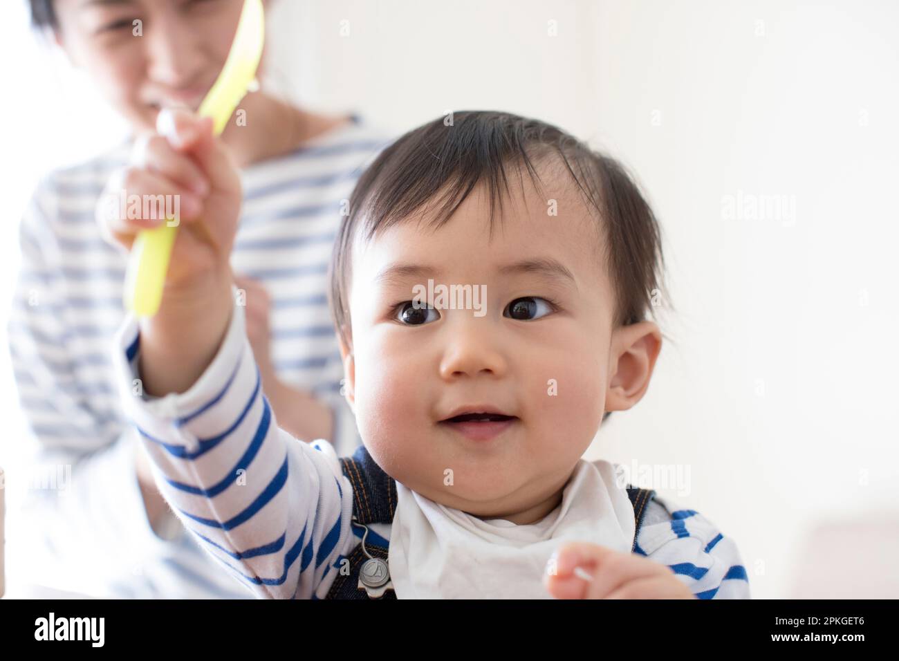 Baby being fed by mother Stock Photo - Alamy