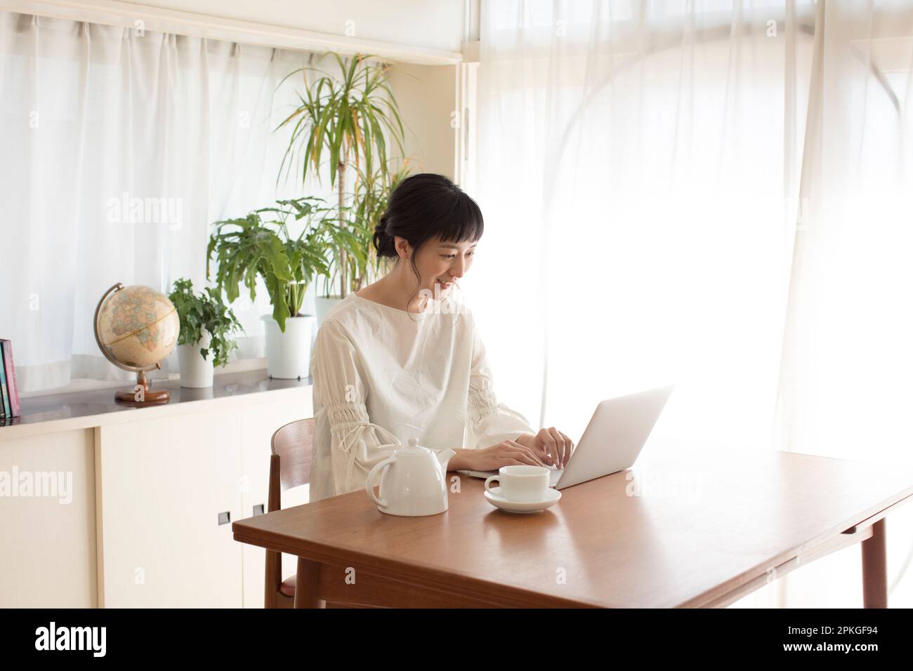 Asian female using computer hi-res stock photography and images - Alamy