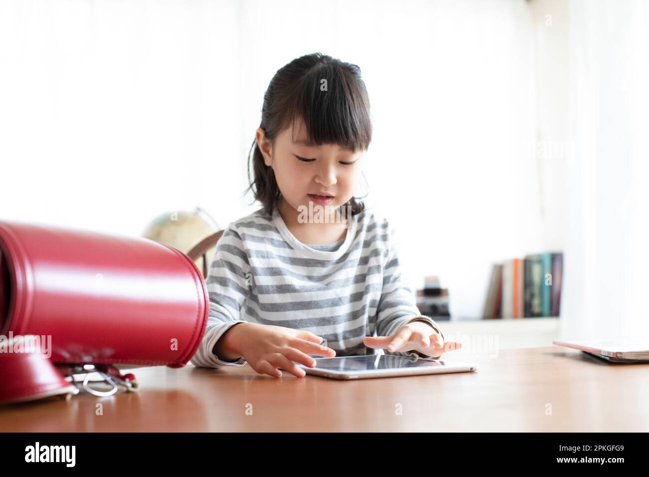 Girl Studying with Tablet Stock Photo - Alamy