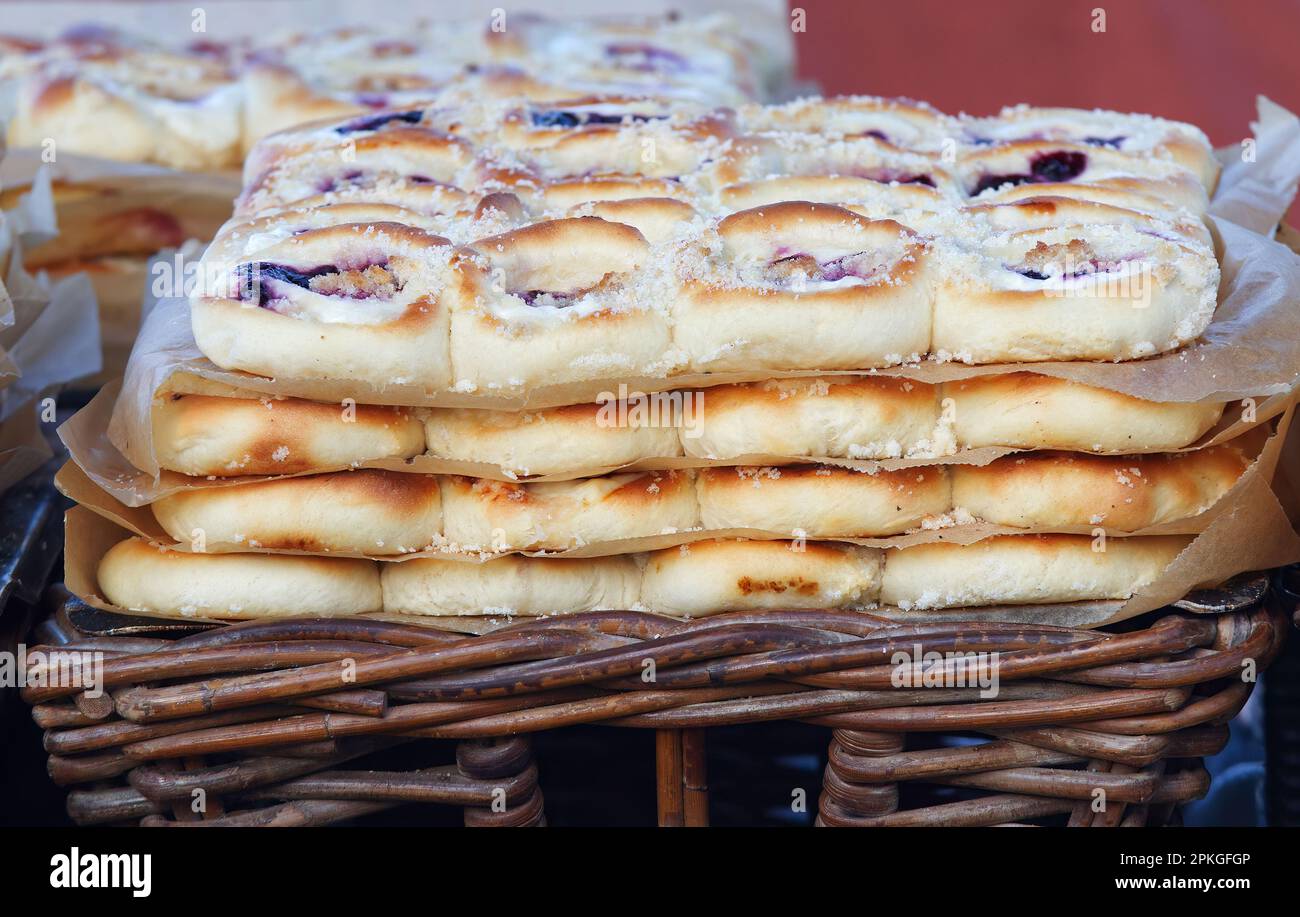 Freshly baked curd pies with plum jam prepared for customers at the ...