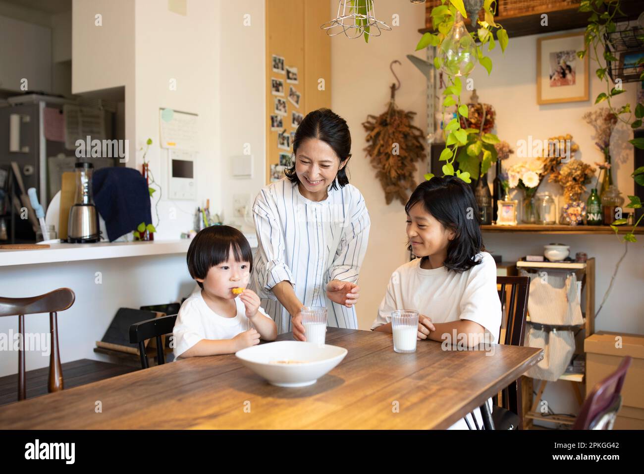 Mother bringing milk to her children Stock Photo - Alamy