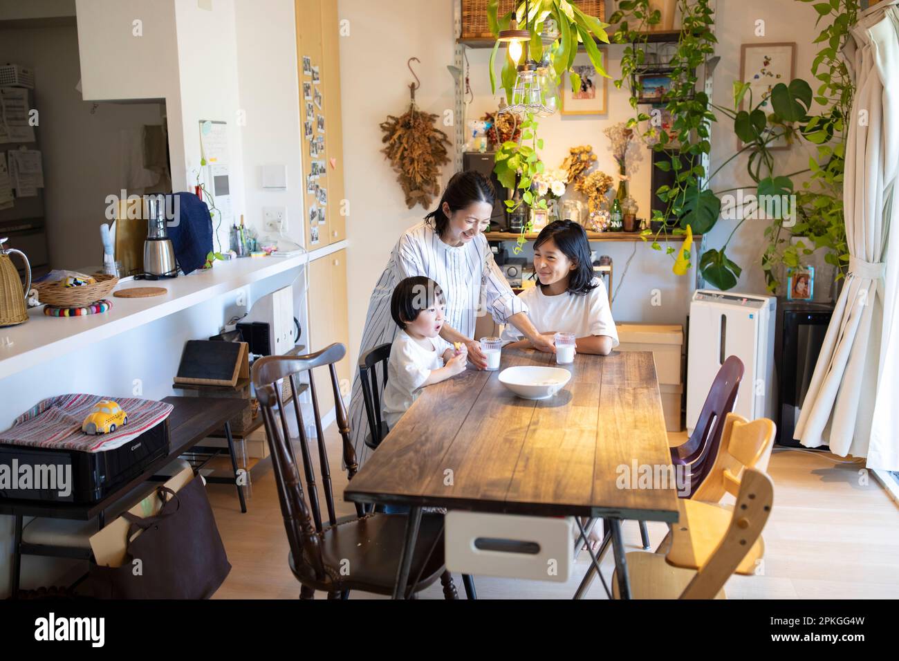 Children bringing milk hi-res stock photography and images - Alamy