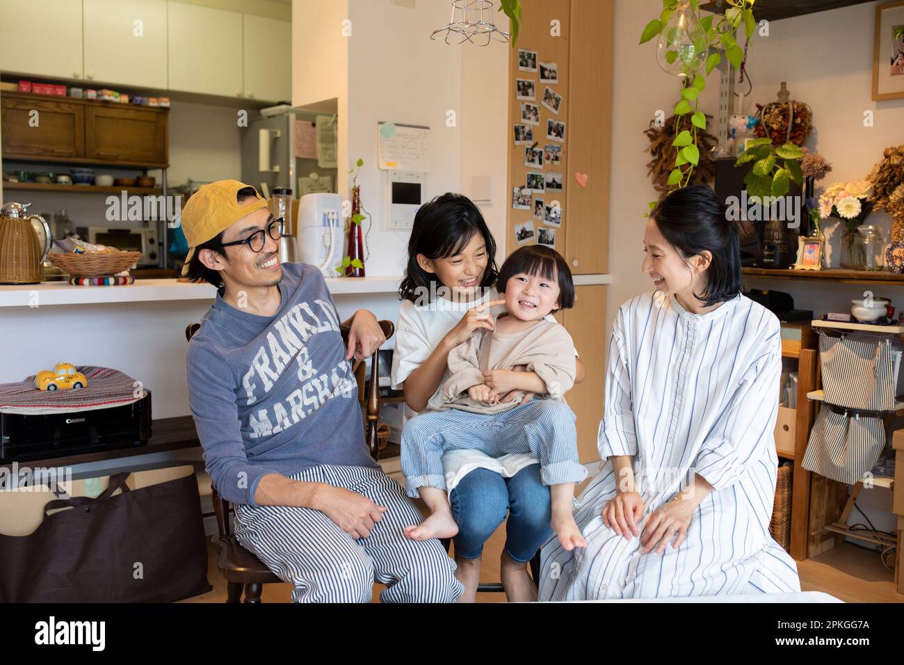 Family gathering in the living room Stock Photo - Alamy