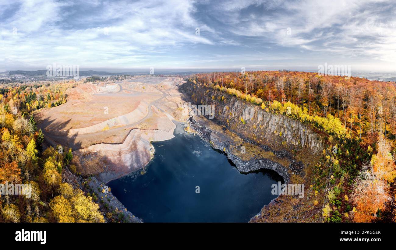 Quarry with a body of water surrounded by lush trees with vibrant ...