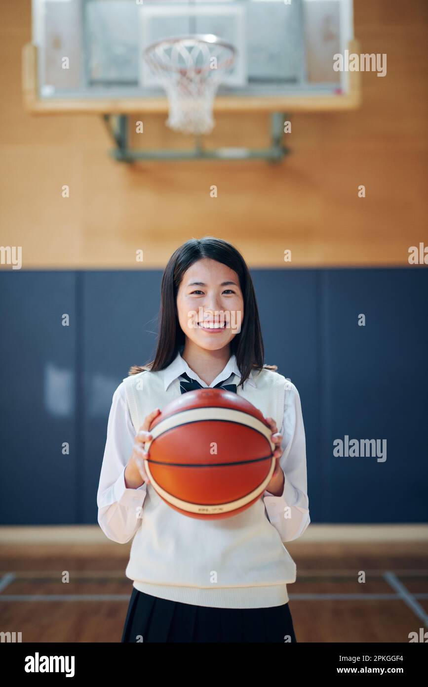High school girl with a basketball in the gym Stock Photo - Alamy