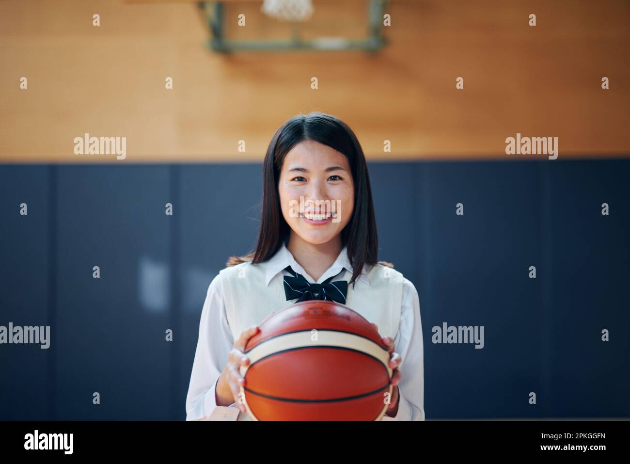 High school girl with a basketball in the gym Stock Photo - Alamy