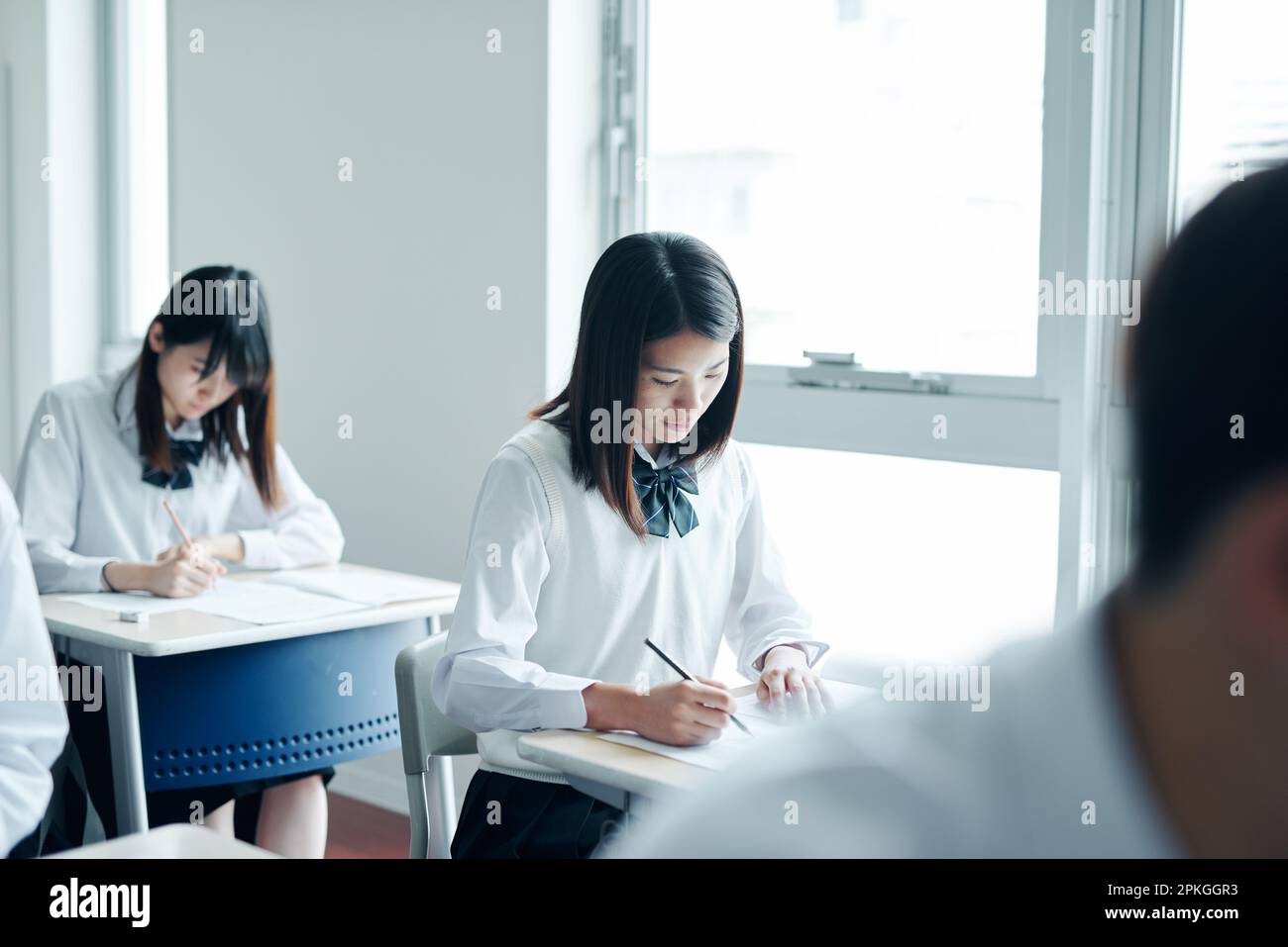Female high school students taking a mock exam in a classroom Stock ...