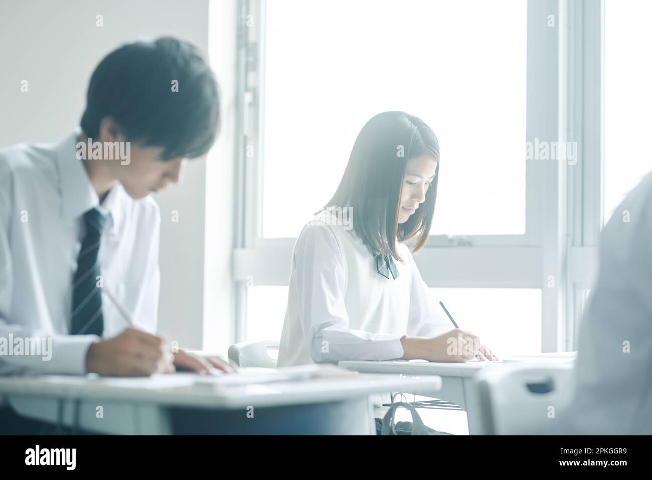 Female high school students taking a mock exam in a classroom Stock ...