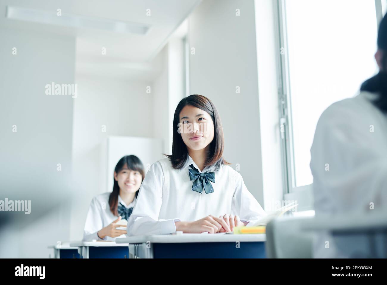 Female high school student taking a class in a classroom Stock Photo ...