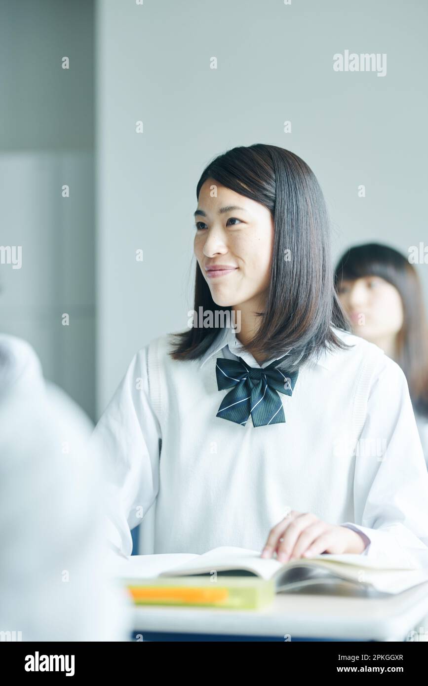 Female high school student taking a class in a classroom Stock Photo ...