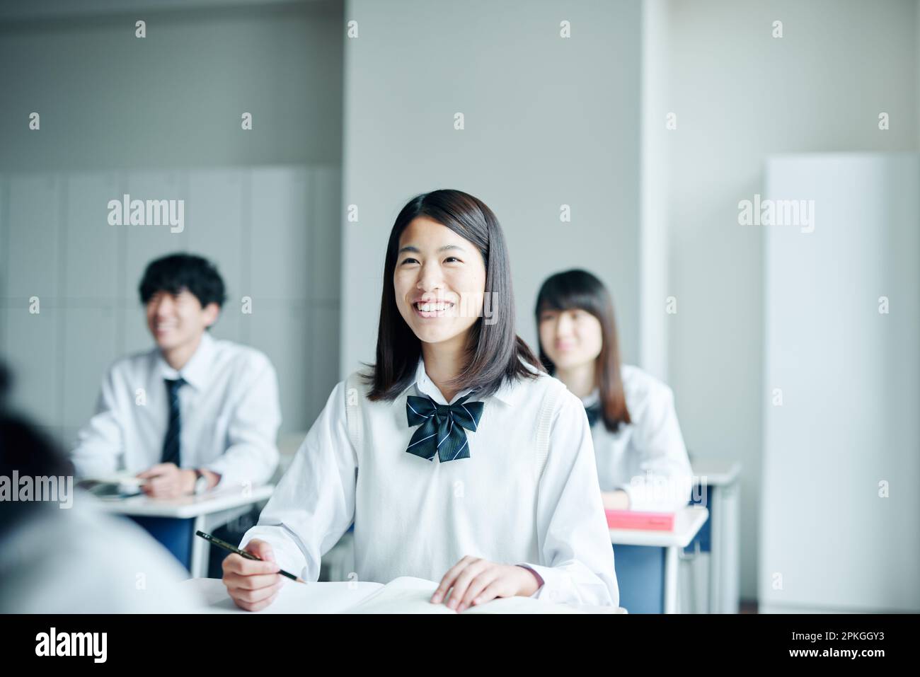 A high school girl taking a class in a classroom Stock Photo - Alamy