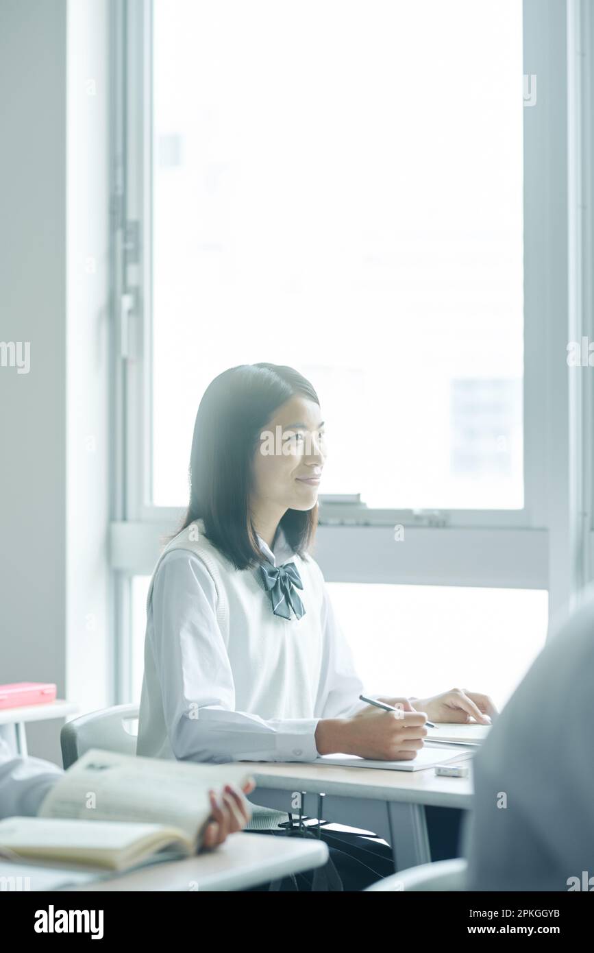 A female high school student taking a class in a classroom Stock Photo ...