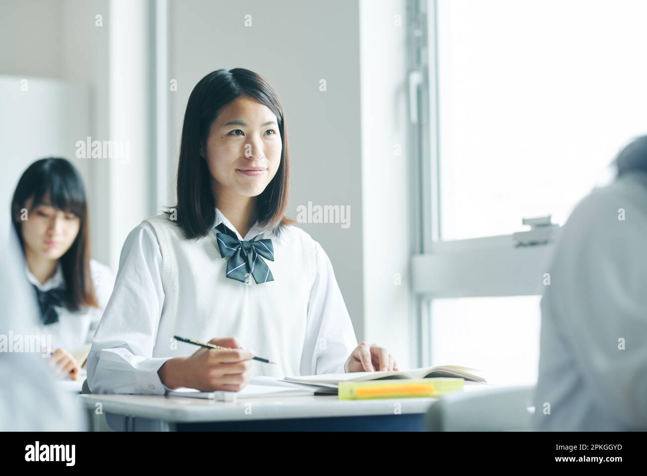 A high school girl taking a class in a classroom Stock Photo - Alamy