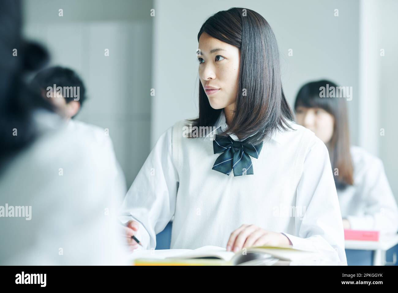 Female high school student taking a class in a classroom Stock Photo ...