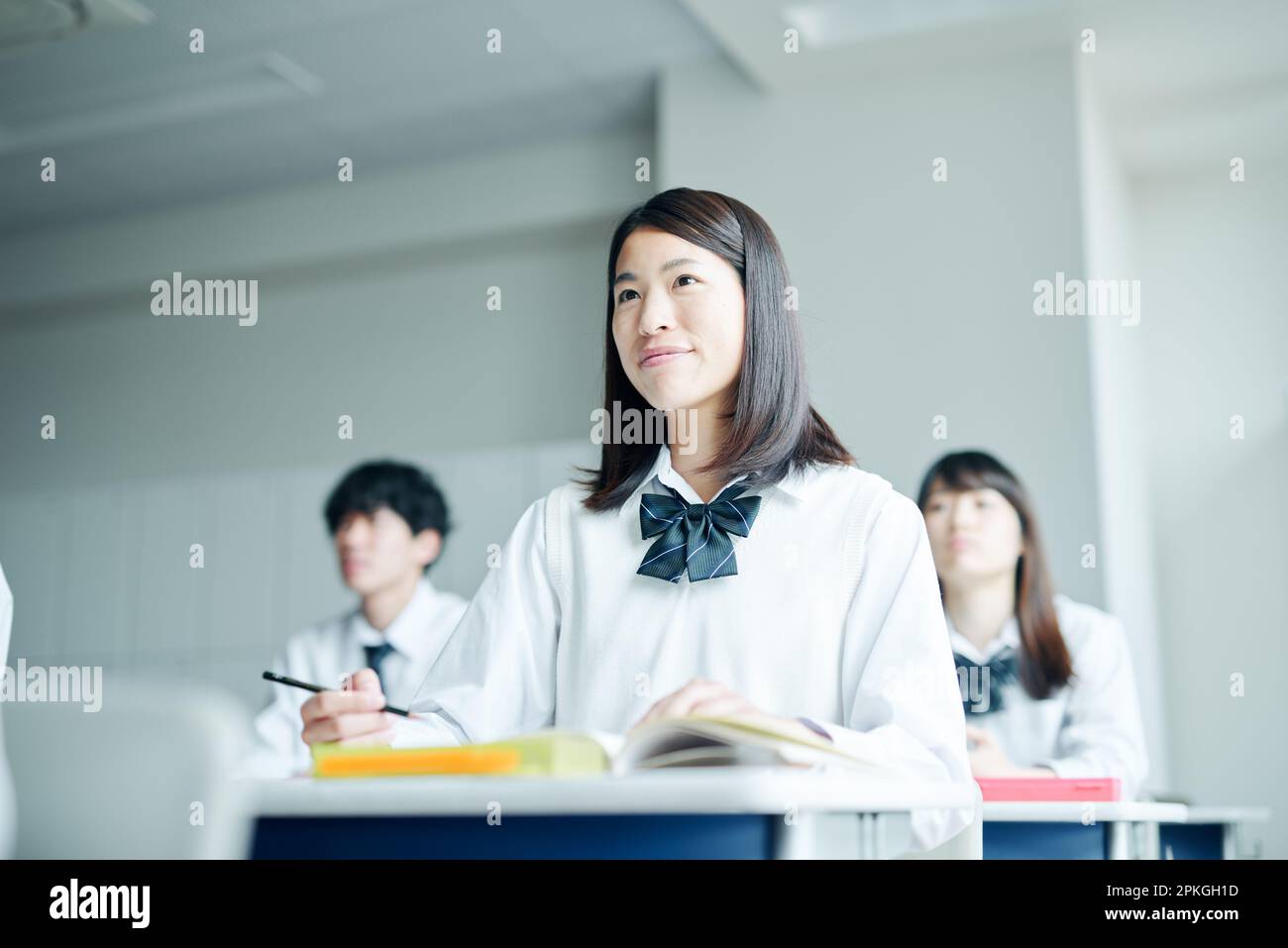 A high school girl taking a class in a classroom Stock Photo - Alamy