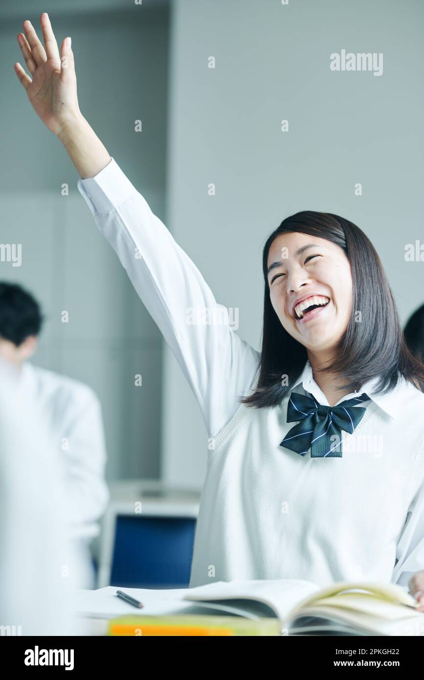 Female high school student taking a class in a classroom Stock Photo ...