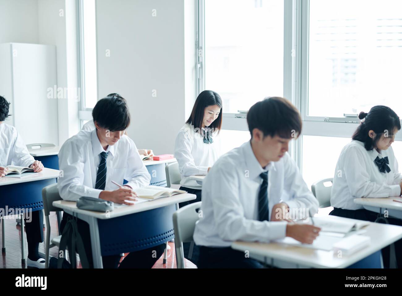 A high school student taking a class in a classroom Stock Photo - Alamy