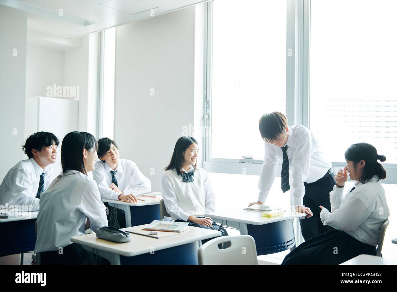High school students chatting in a classroom during recess Stock Photo ...