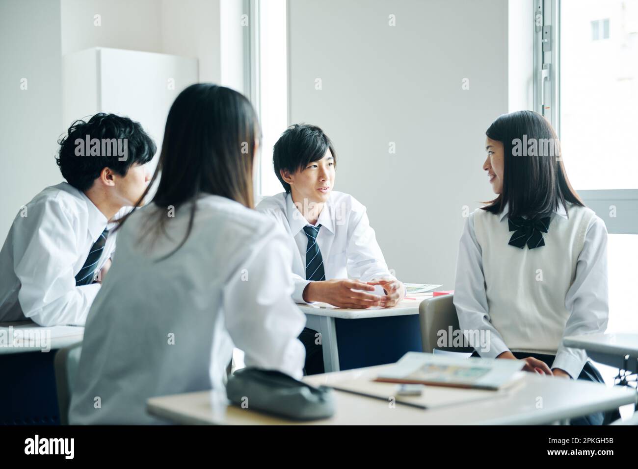High school students discussing in the classroom Stock Photo - Alamy