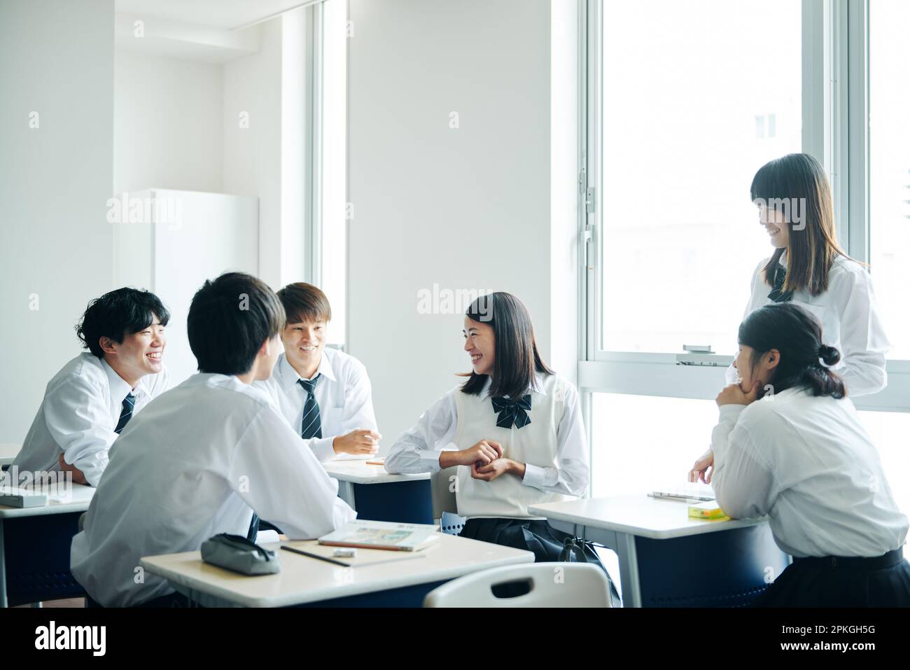 High school students chatting in a classroom during recess Stock Photo ...