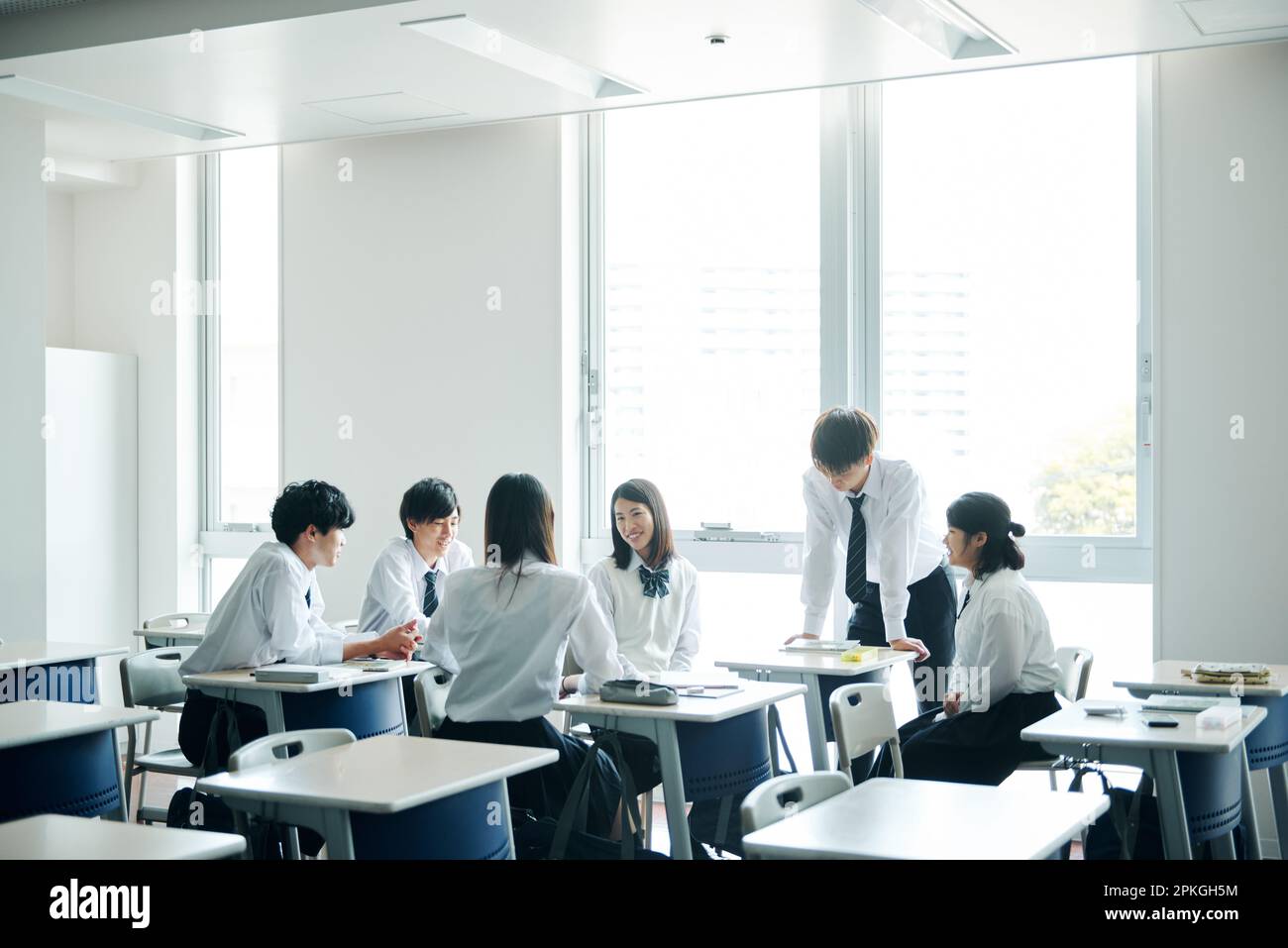 High school students chatting in a classroom during recess Stock Photo ...