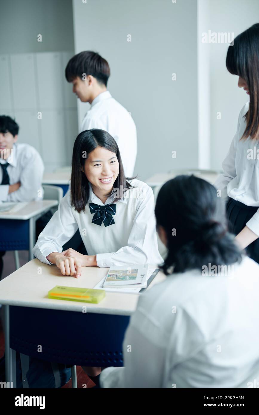 High school students chatting in a classroom during recess Stock Photo ...