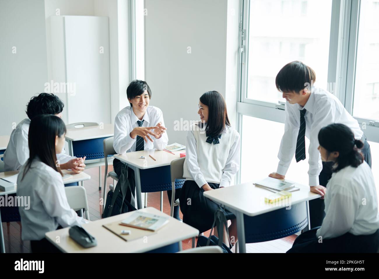 High school students chatting in a classroom during recess Stock Photo ...