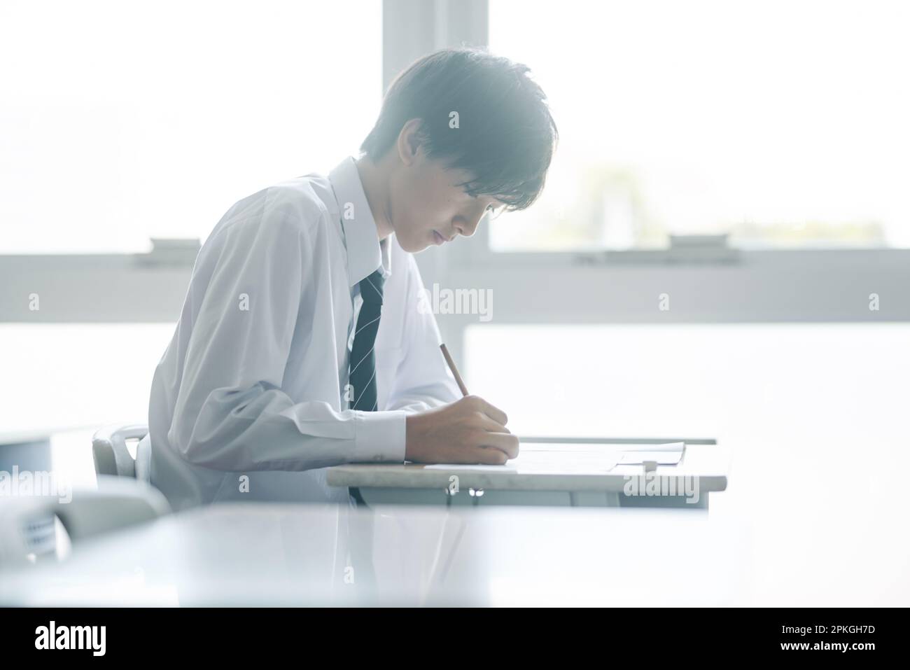 A high school boy takes a mock exam in the classroom Stock Photo - Alamy
