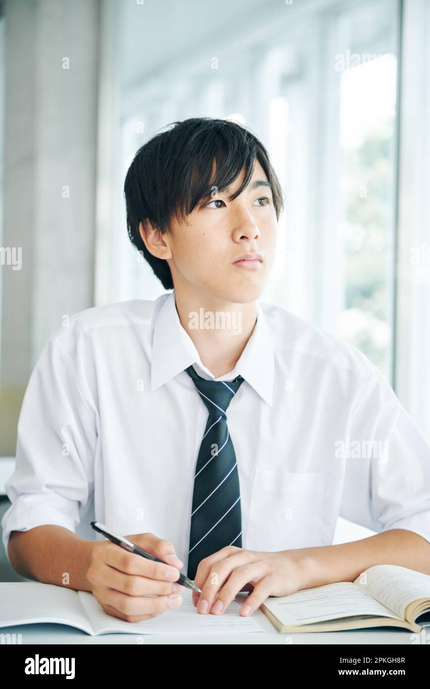 A high school boy taking a class at a cram school Stock Photo - Alamy