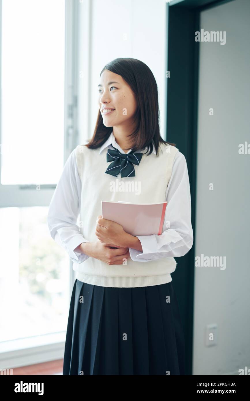 High school girl with notebook in her hand Stock Photo - Alamy