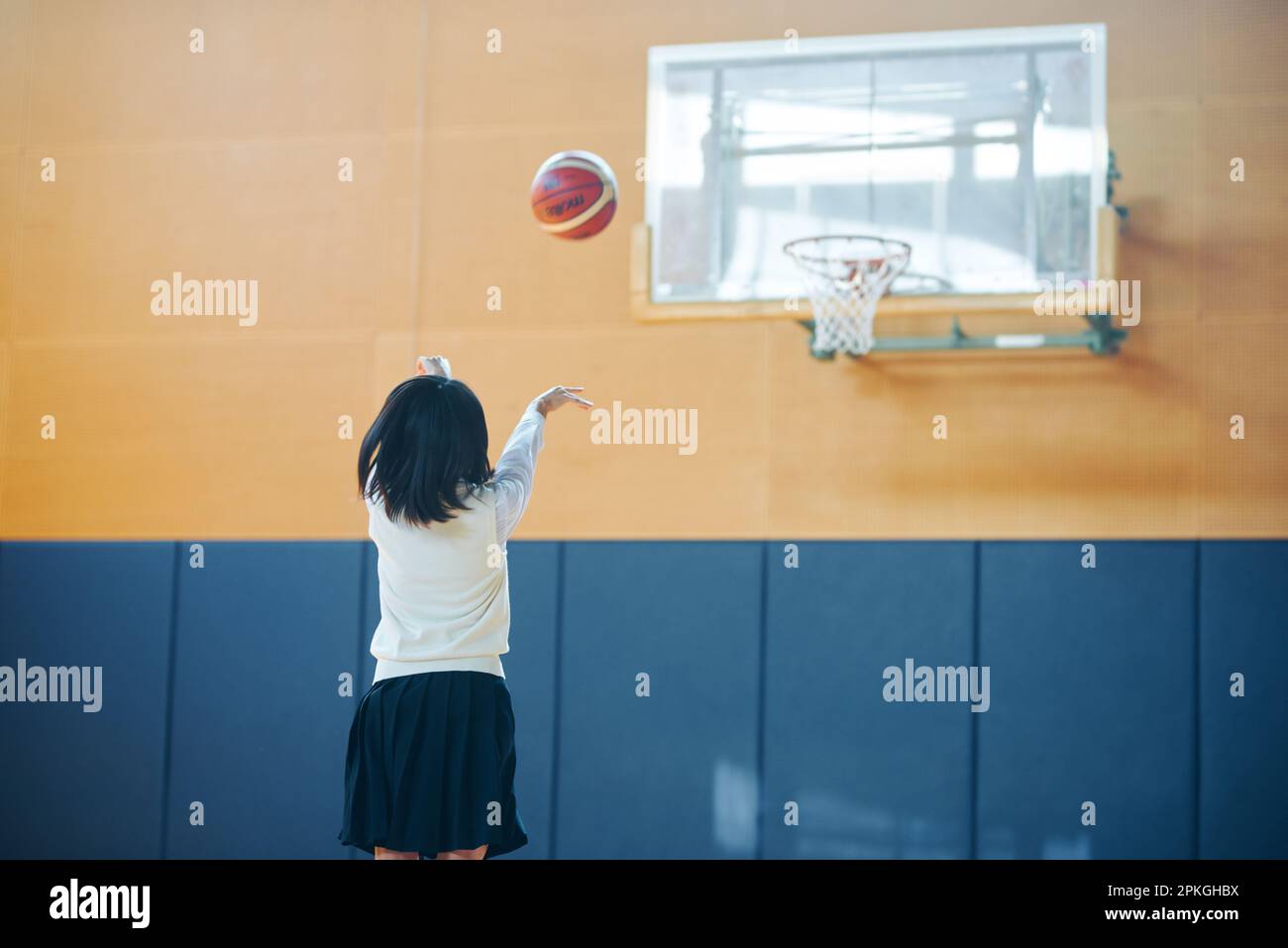 High school girls playing basketball in gymnasium Stock Photo - Alamy