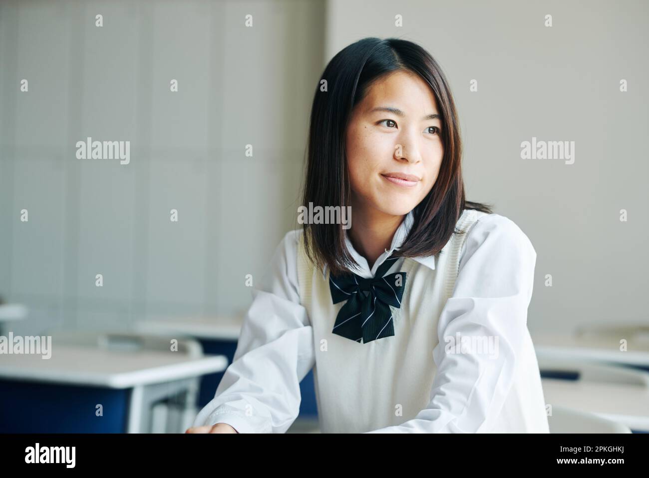 Smiling high school girls in a classroom Stock Photo - Alamy