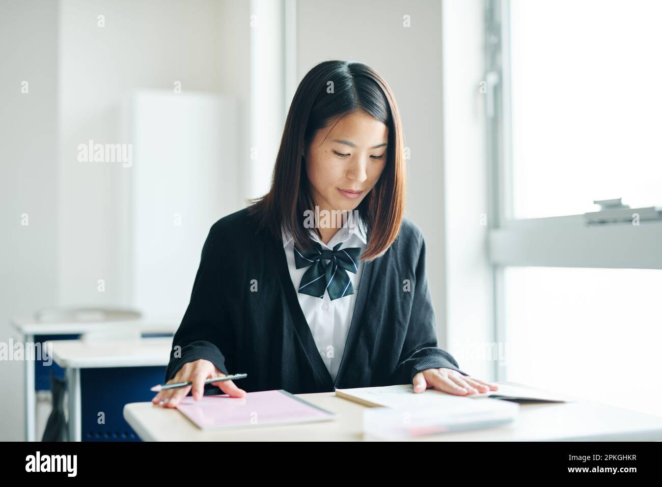 Girls studying in classroom hi-res stock photography and images - Alamy