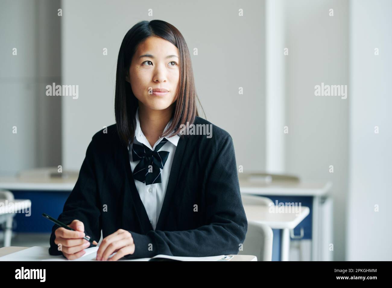 High school girls smiling in the classroom Stock Photo - Alamy