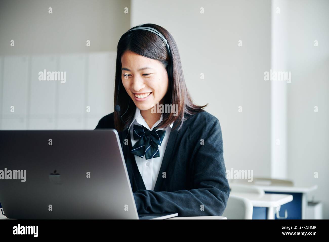 High school girls operating a computer in a classroom Stock Photo - Alamy