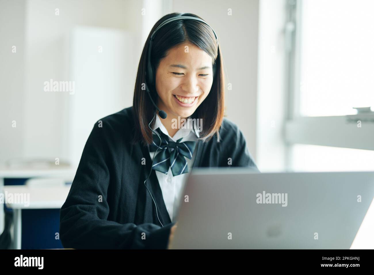 High school girls operating a computer in a classroom Stock Photo - Alamy