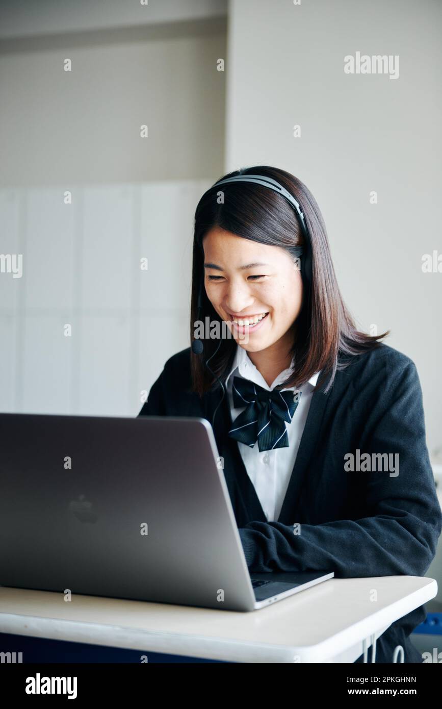High school girls operating a computer in a classroom Stock Photo - Alamy