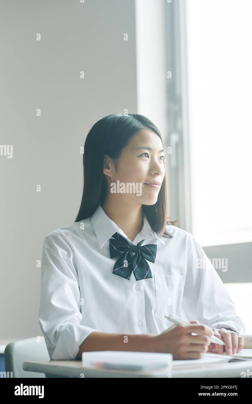 High school girls studying in a classroom Stock Photo - Alamy
