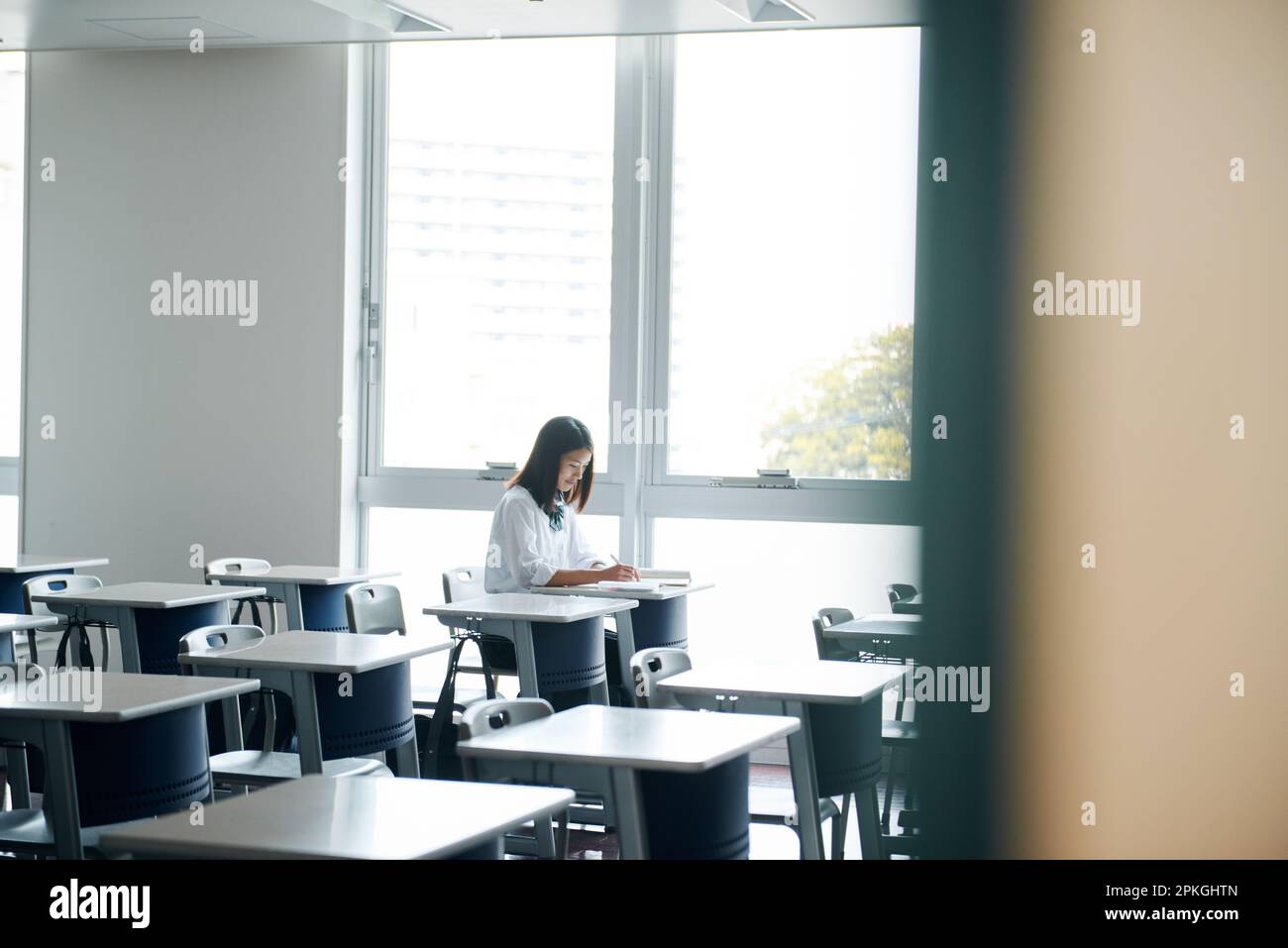 High school girls studying in a classroom Stock Photo - Alamy
