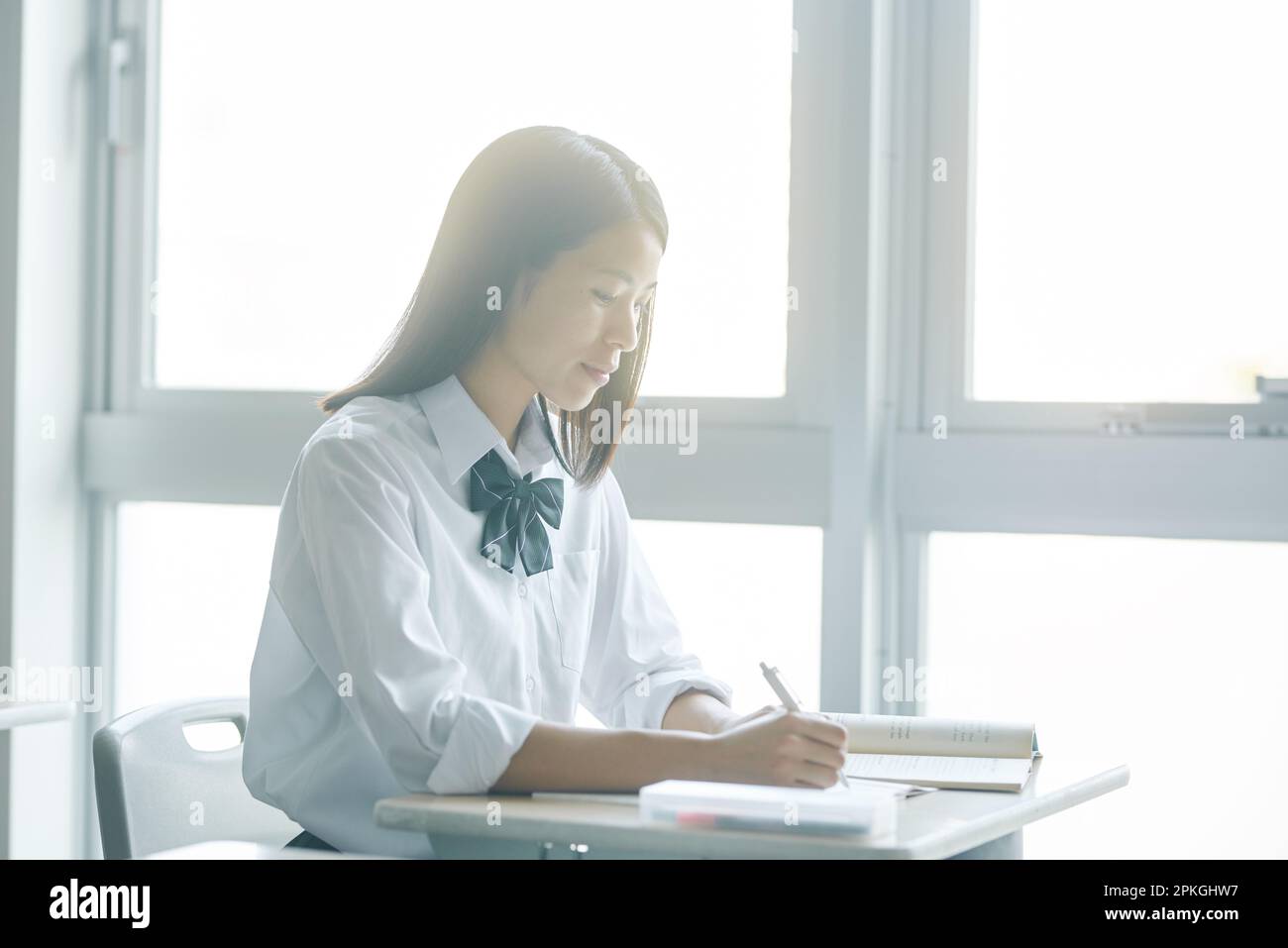 High school girls studying in a classroom Stock Photo - Alamy