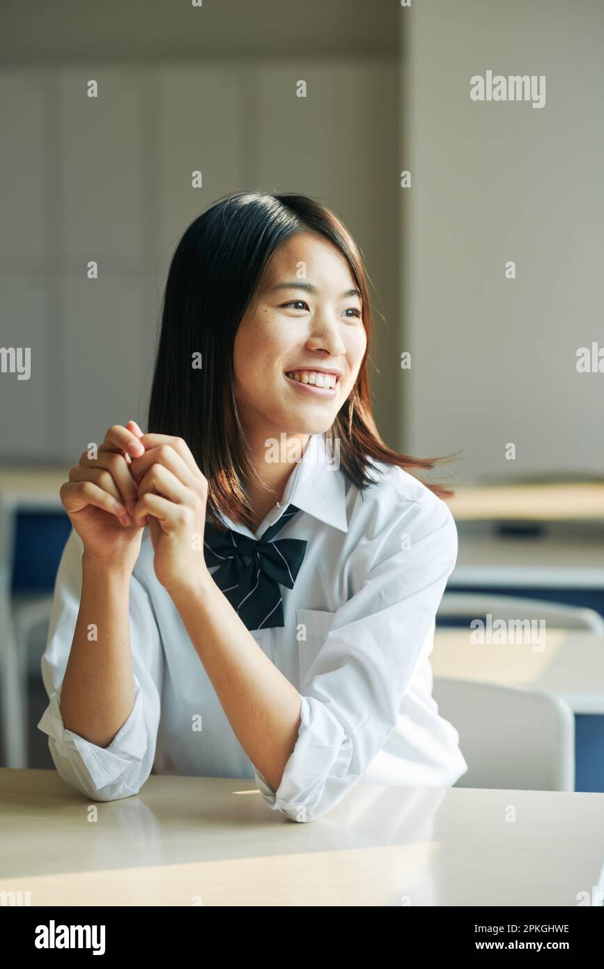 Smiling high school girls in a classroom Stock Photo - Alamy