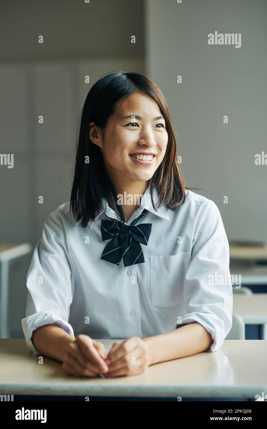 Smiling high school girls in a classroom Stock Photo - Alamy